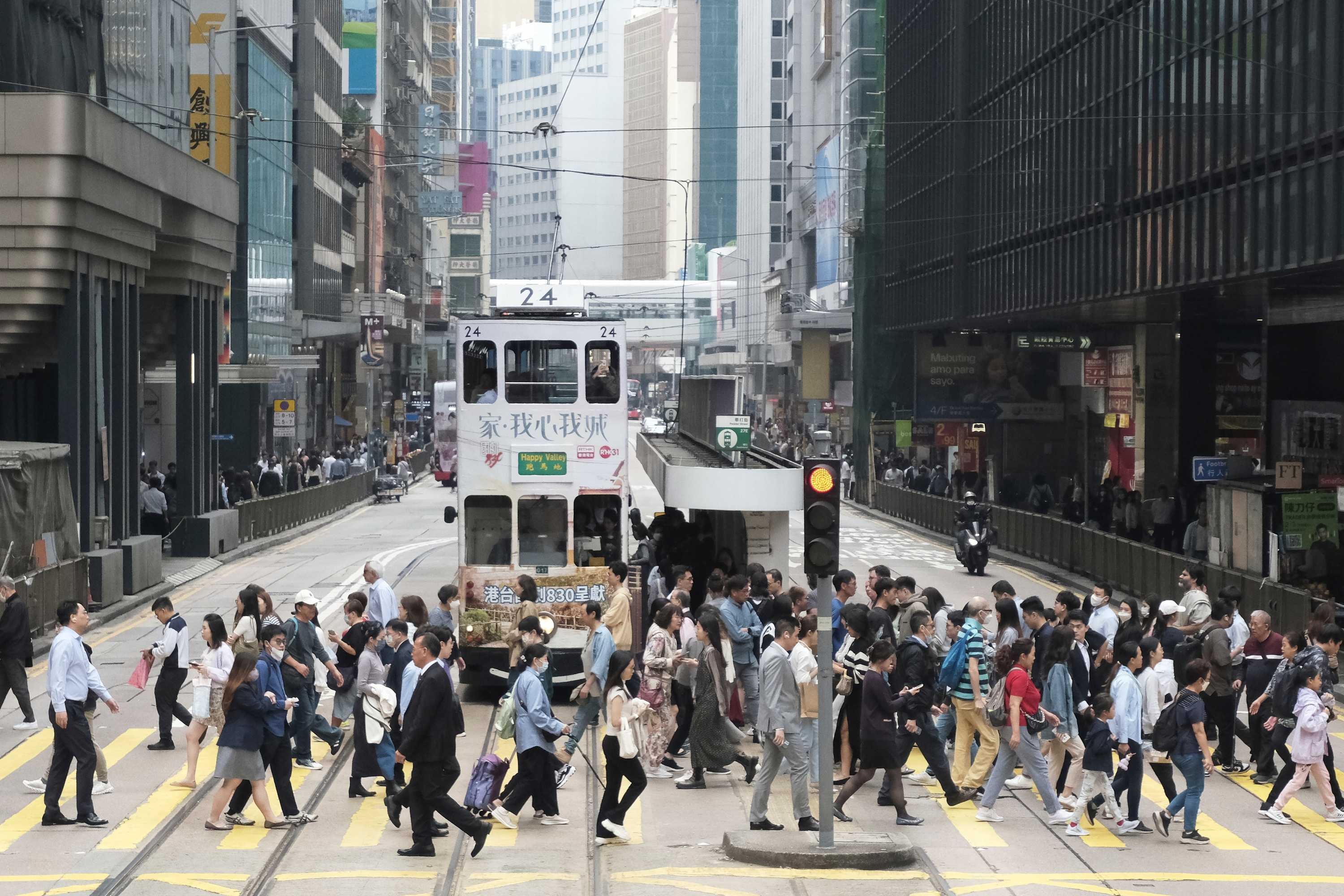 How does "One Country, Two Systems" ensure stability of HK and Macao ...